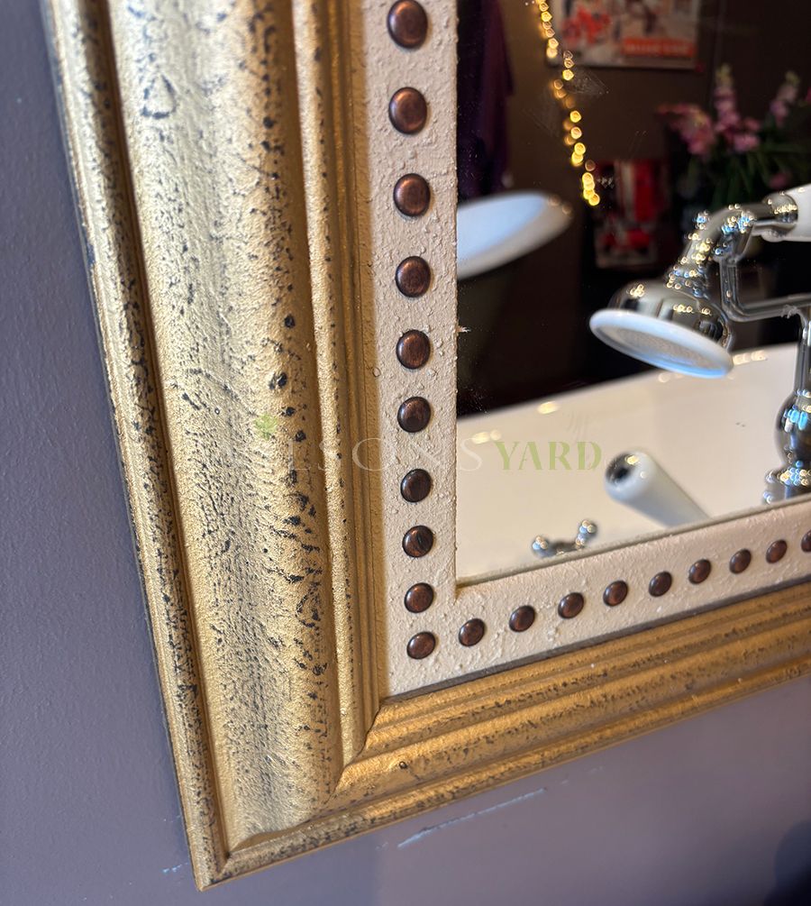 Stylish & studded gilt mirror