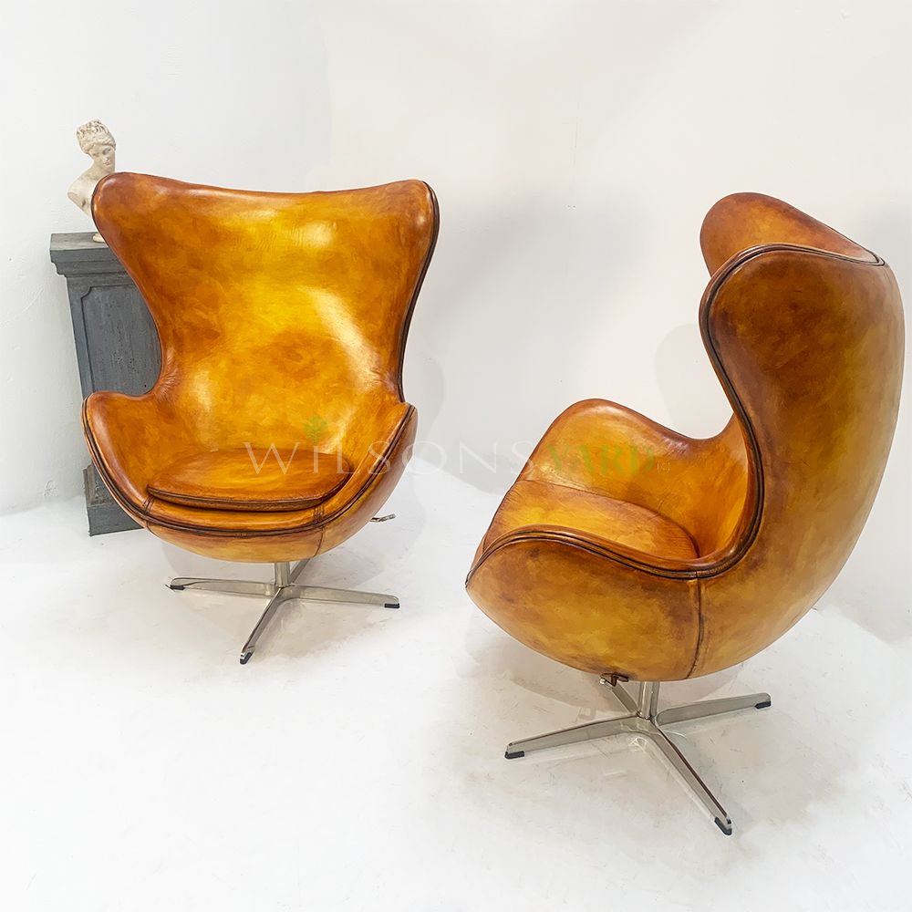 Pair of Iconic restored leather egg chairs